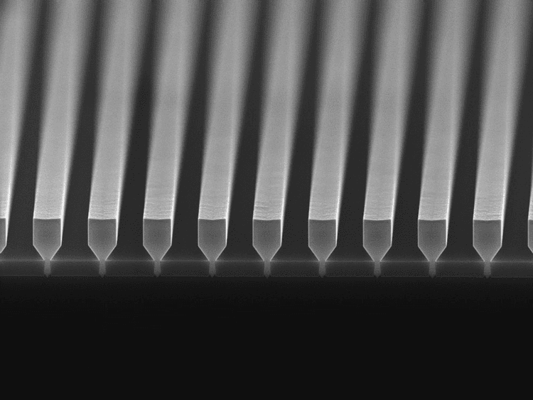 Full-wafer fabrication of GaAs nano-ridge lasers | imec